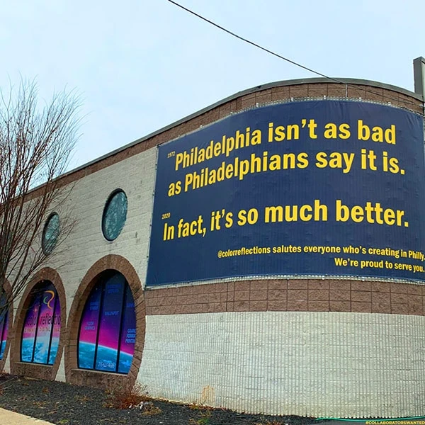 Color Reflections Philadelphia building with banner draped on it